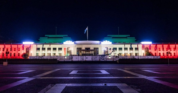 Iconic structures in Canberra lit up in red and green