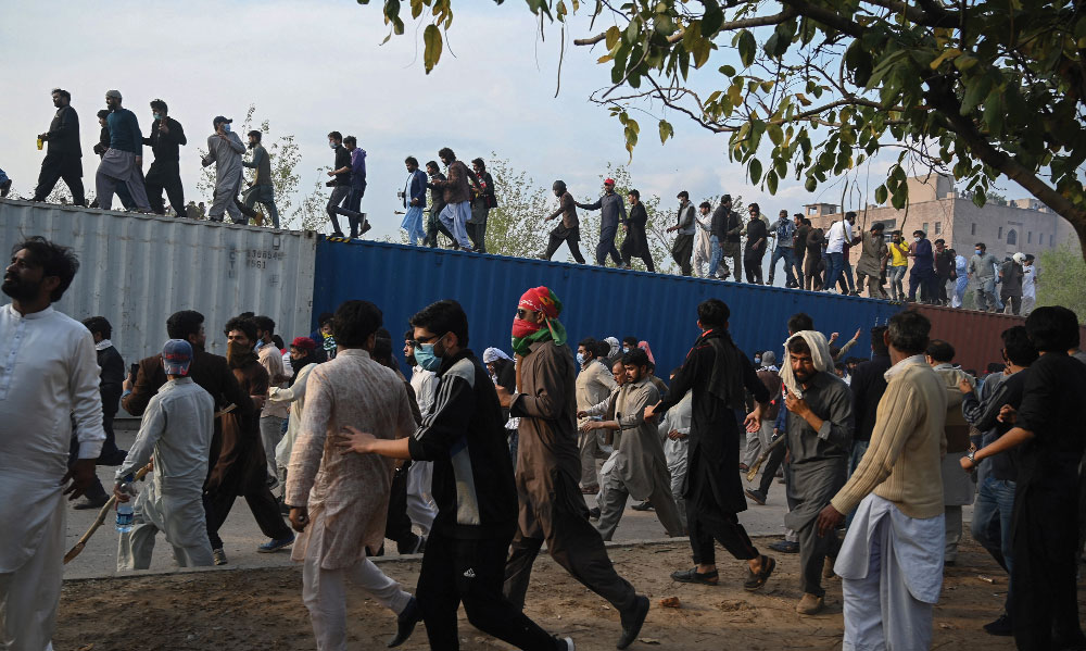 Pakistani police storm home of former PM Khan, arrest 30